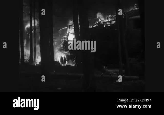 GERMANY - 1945 - German tanks burn and German POWs walk in a group to ...