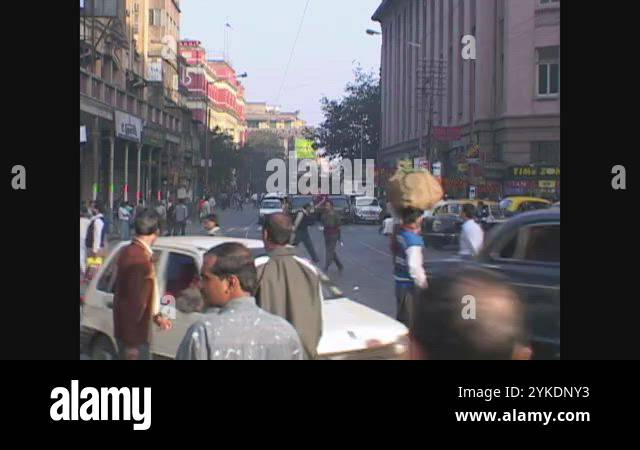 CALCUTTA - 1999 - Foot and vehicular traffic share a busy street in ...