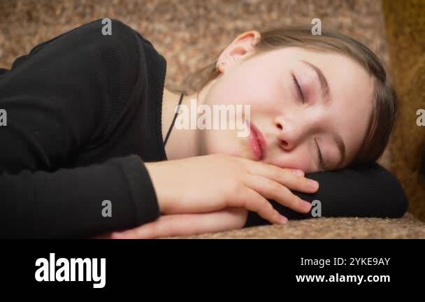 Portrait girl sleeping eyes moving under closed eyelids. Girl experiencing nightmare, deep in ...
