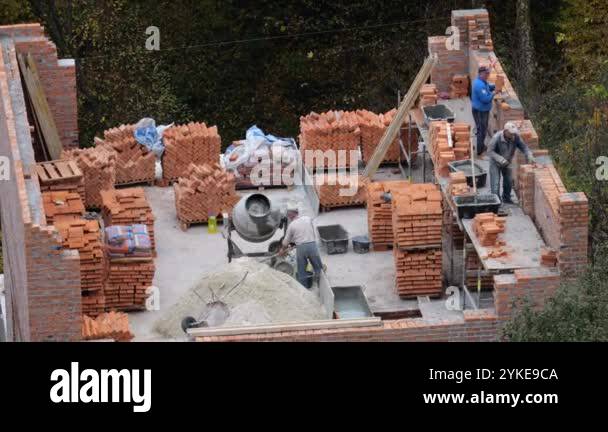 LVIV, UKRAINE - OCTOBER 20, 2024: Construction site. Builder workers ...