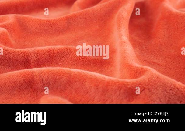 Soft folds of natural velvet salmon shades of pink. Textile background on the theme design ...
