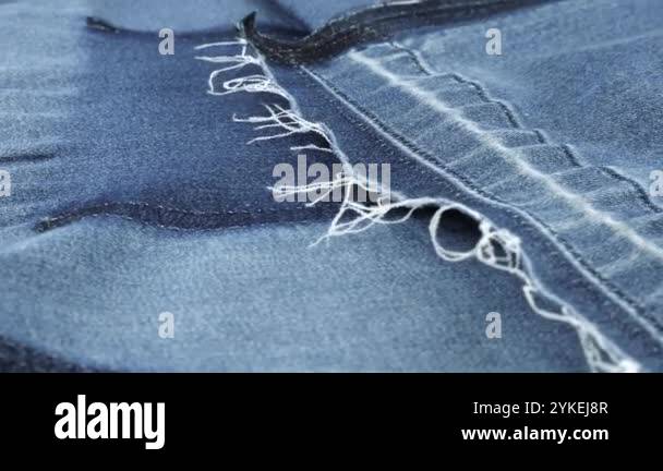 Expressive texture of clothing details after ripping made of dark blue ...