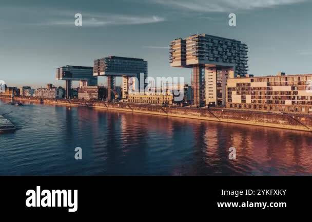 Modern cityscape with unusual buildings in the shape of cranes. Barges ...