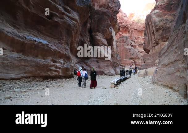 JORDAN, PETRA, DECEMBER 5, 2016: People in Siq - narrow passage, gorge ...