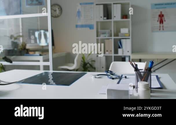 Interior of well-organized modern medical office, with desks, posters ...