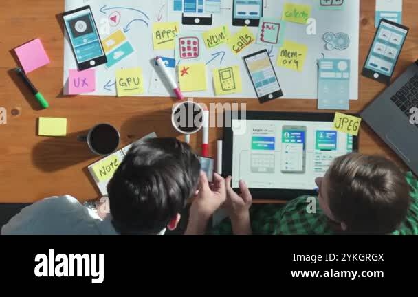 Top down view of manager working together to develop Ux Ui design for ...