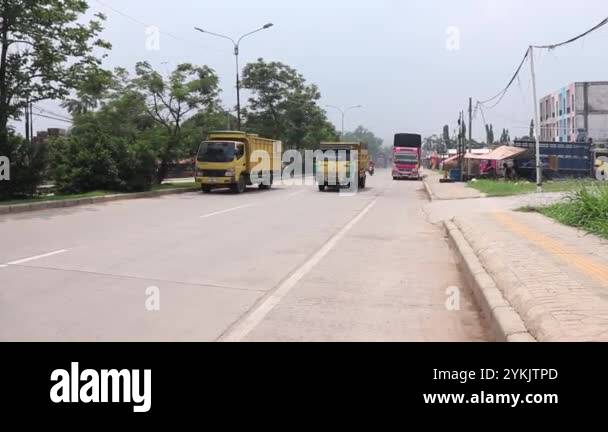Palembang, Indonesia - November, 2024: The busy road traffic is smooth ...