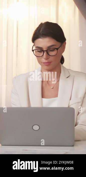 Vertical video. Successful work. Tired woman. Finish project. Hard ...