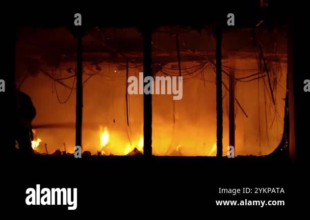 Fire extinguishing, fire brigade inside burning premises. Brave firemen ...