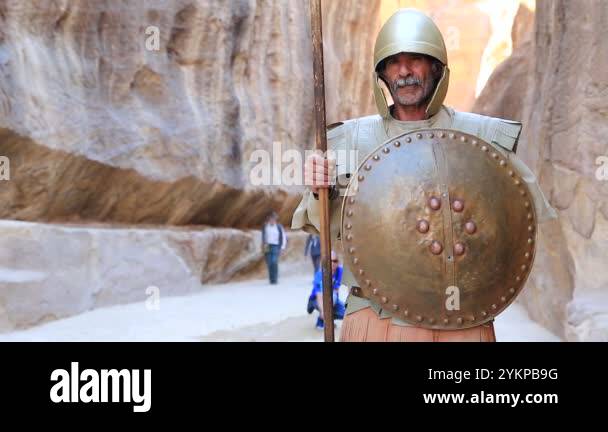 JORDAN, PETRA, DECEMBER 5, 2016: Nabatean soldier and people in Siq ...