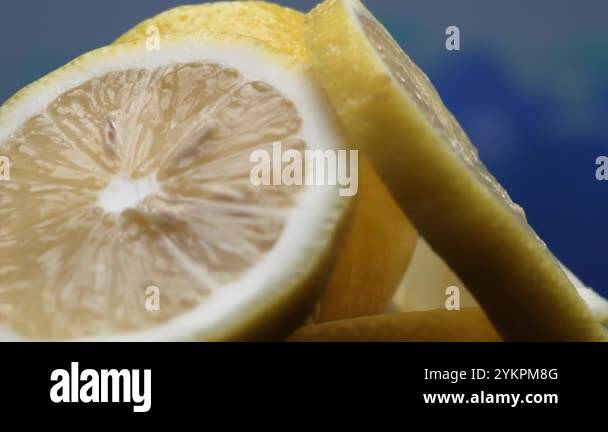 A slice of fresh lemon, bright yellow and vibrantly citric, lies ...