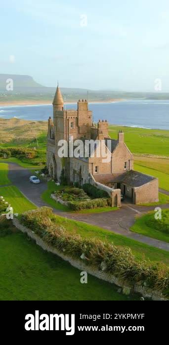 Spectacular aerial vertical orbit sunset view of Classiebawn Castle and ... Spectacular aerial vertical orbit sunset view of Classiebawn Castle and ...