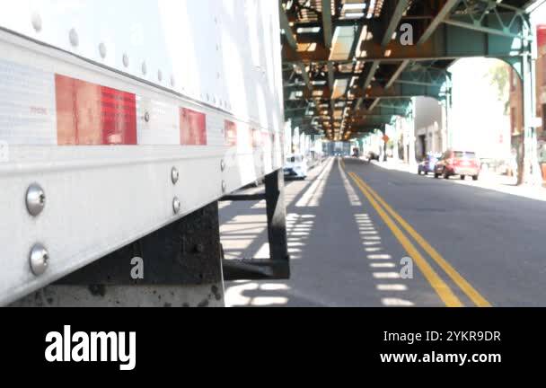 Elevated subway above New York city street. Metropolitan bridge over ...