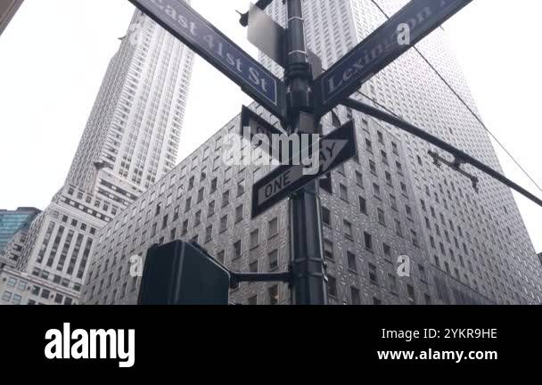 New York City crossroad, street intersection road sign on post ...