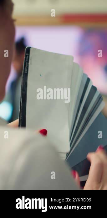 Vertical video Saleswoman in dealership talking with client, offering ...