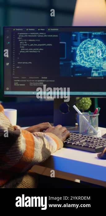 Vertical Video African american man using AI to develop a software system with chroma key on pc ...