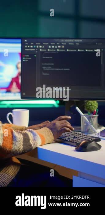 Vertical Video Programmer In Home Office Concentrating On Finding Bugs While He Codes On His