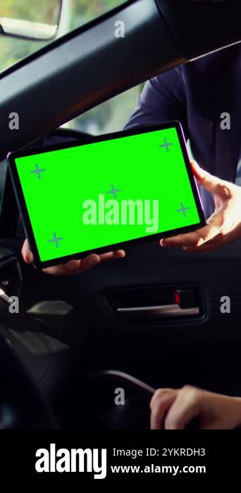 Vertical video Showroom salesman showing car brochure and price list on ...