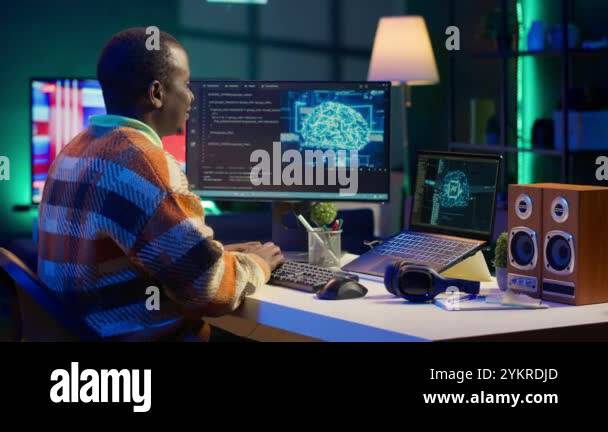 African american IT professional managing AI system for machine learning, coding software on ...
