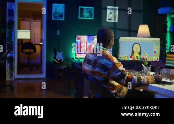 Remote graphic designer using advanced editing software to retouch ...