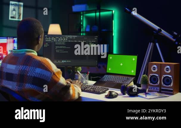 Black web developer handling database servers for safety with green ...