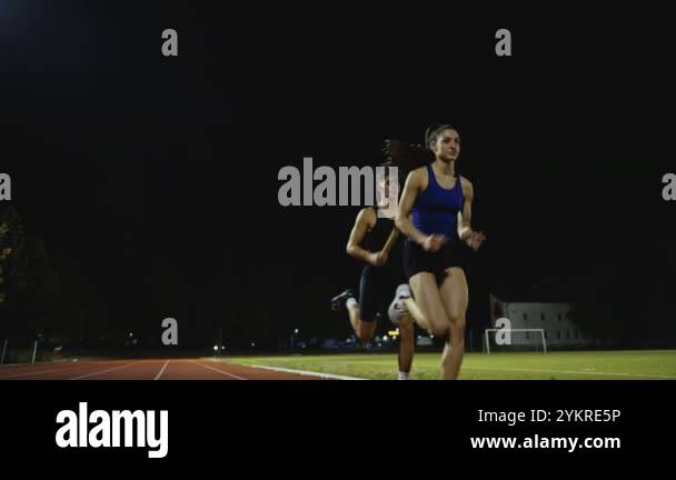 Athletes couple, male and female running a relay race and pass the ...