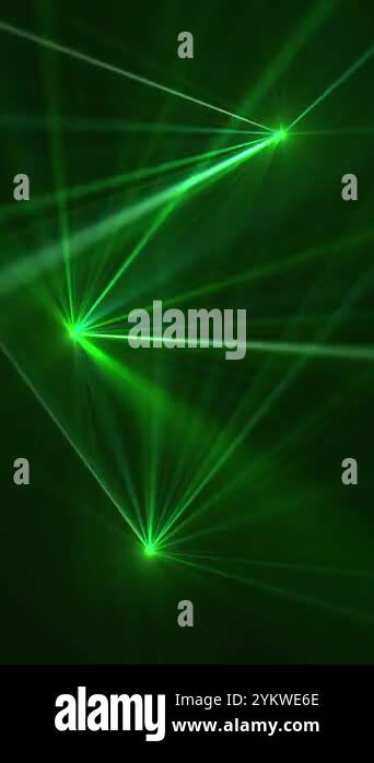 High speed laser light show on black background with flashing green ...