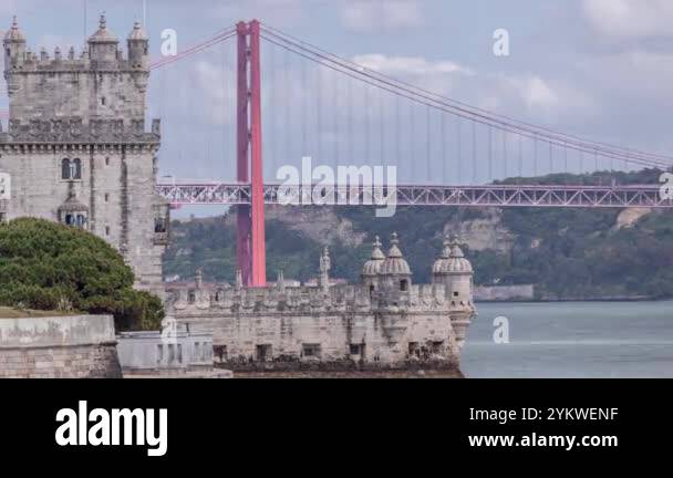 Cityscape with Torre de Belem or Belem Tower and red iconic 25 de Abril ...
