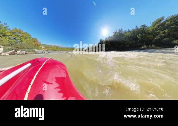 A head-on view of a splash hitting a rafting boat as it tackles fast ...