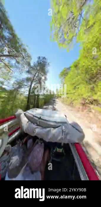 Vertical video. A 360-degree camera shot from the back of an Off-road ...
