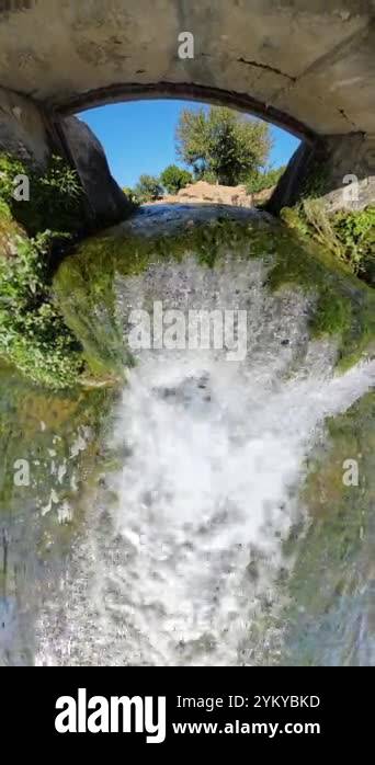 Vertical video. The camera captures the view from the top of a small ...