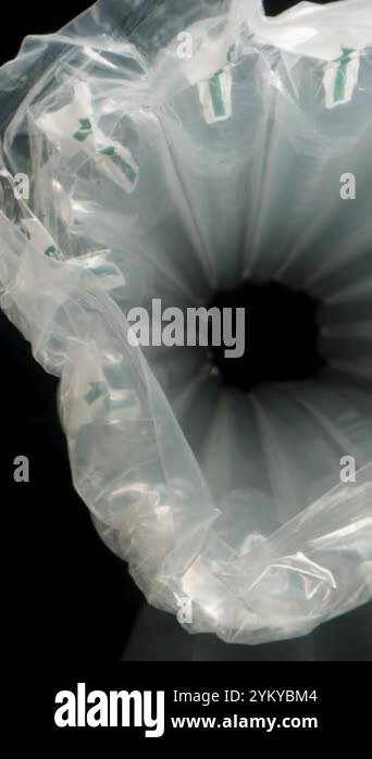 Vertical video. Close-up view inside a cylindrical air cushion ...