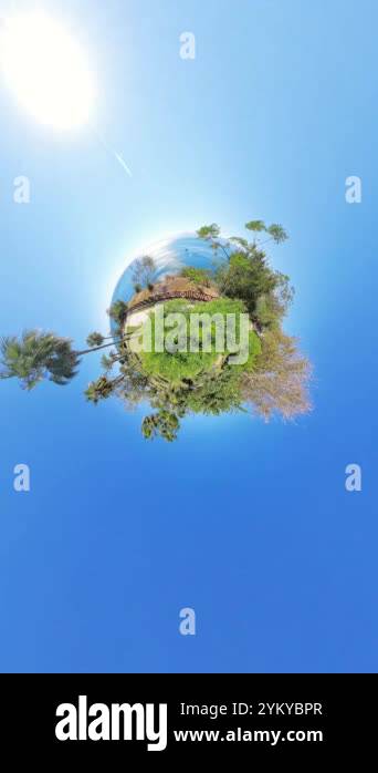 Vertical video. A wide-angle Tiny Planet effect captures a small ...