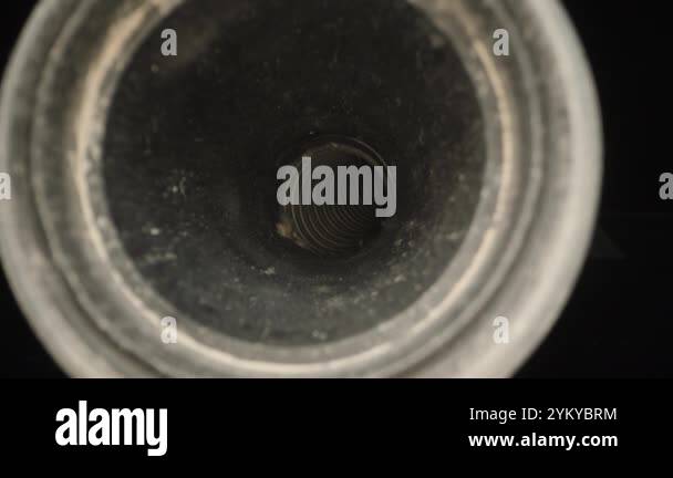 Slider. vacuum cleaner hose. View through the mouth of a blackened tube ...