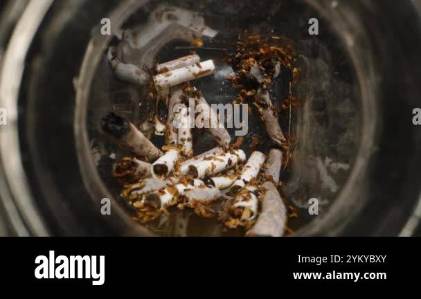 Dolly slider, close up. Close-up view of a glass jar filled with water ...