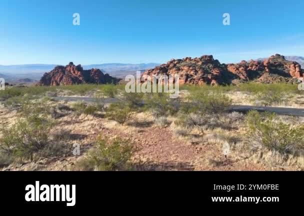 Aerial Fly Through: Experience the majestic Snow Canyon in Ivins, Utah, with vibrant red rocks ...