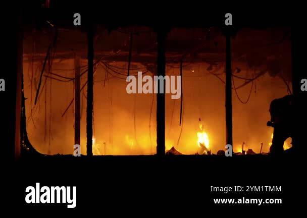 Brave fireman inside burning building. Fire extinguishing, fire brigade ...