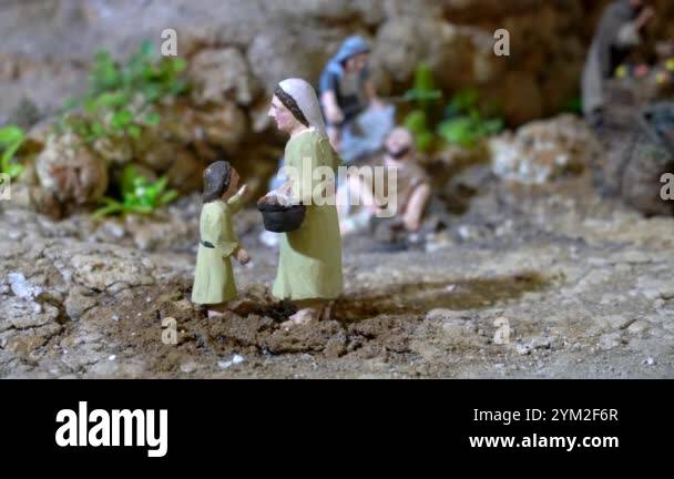 Animated nativity scene features a mother holding a basket, engaging in ...