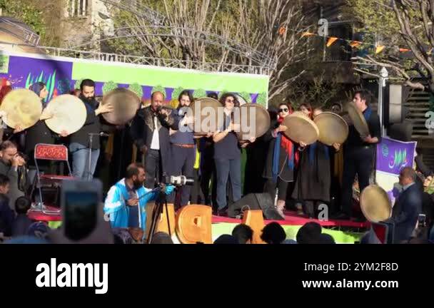 Musicians and singers performing on stage at a vibrant street fair in ...