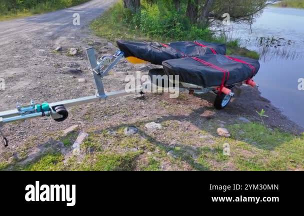 Boat trailer with fishing kayaks near the boat launch drop off at the ...