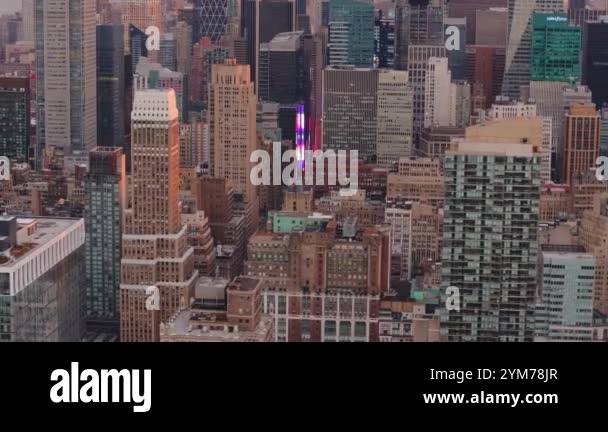 Aerial views capture Times Square in New York City at sunset, with ...