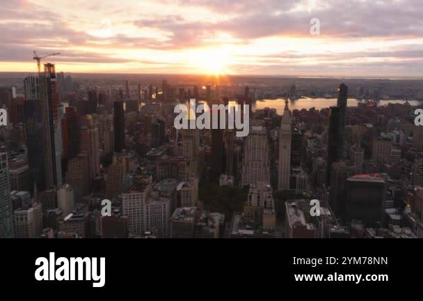 Aerial views showcase the sun rising over the New York City skyline ...