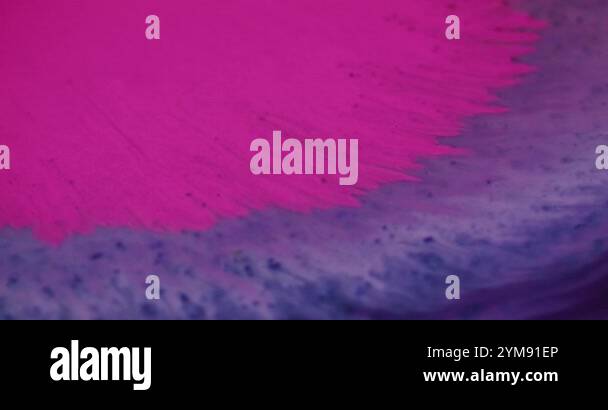 Spreading paint. Pink expansion. Wide current mix colors of dye dust ...