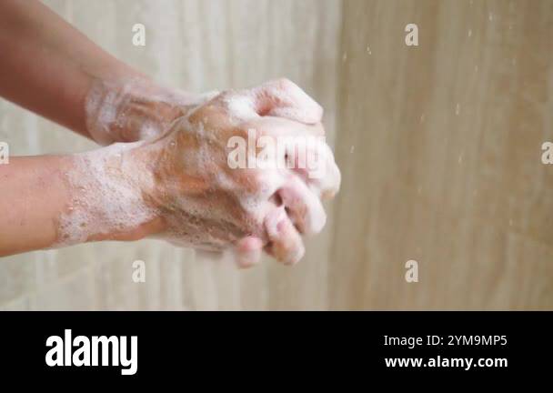 Daily personal hygiene and handwashing with foam soap close-up, slow ...