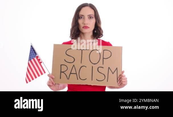 Woman shows Stop Racism sign holding American flag on white background ...