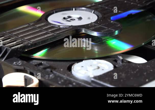 An open DVD player shows its internal components and circuitry, with ...