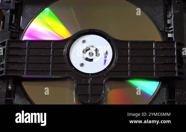 An open DVD player shows its internal components and circuitry, with ...