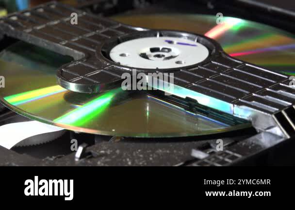 An open DVD player shows its internal components and circuitry, with ...