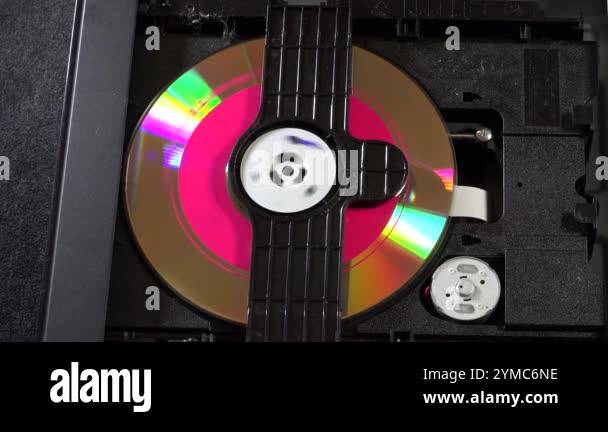 An open DVD player shows its internal components and circuitry, with ...