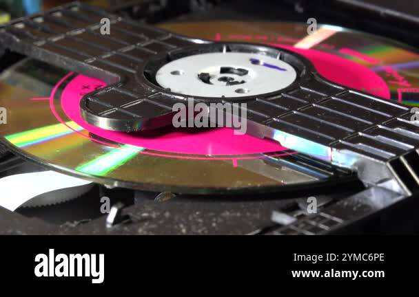 An open DVD player shows its internal components and circuitry, with ...